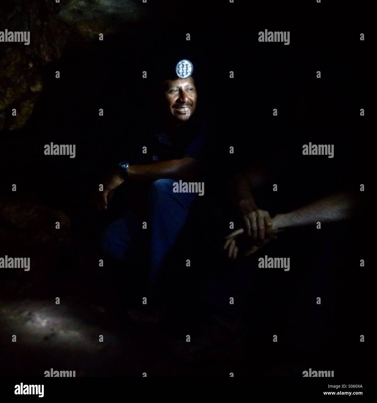 A tourists guide smiles in Calcehtok cave in Yucatan, Mexico. This ...