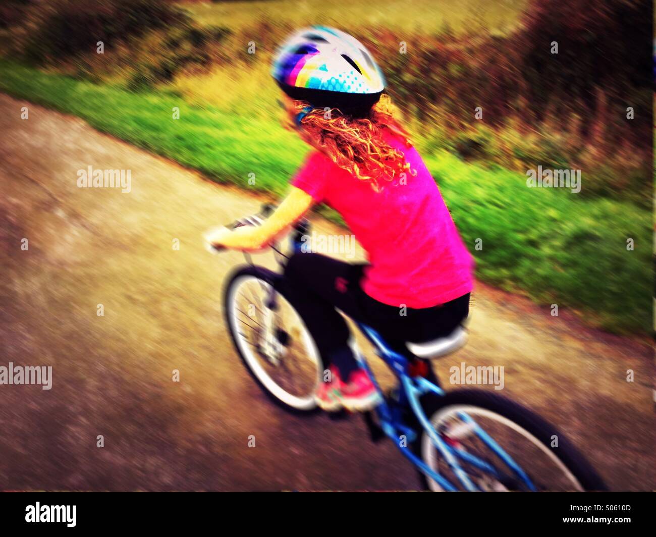 Girl riding bike Stock Photo - Alamy