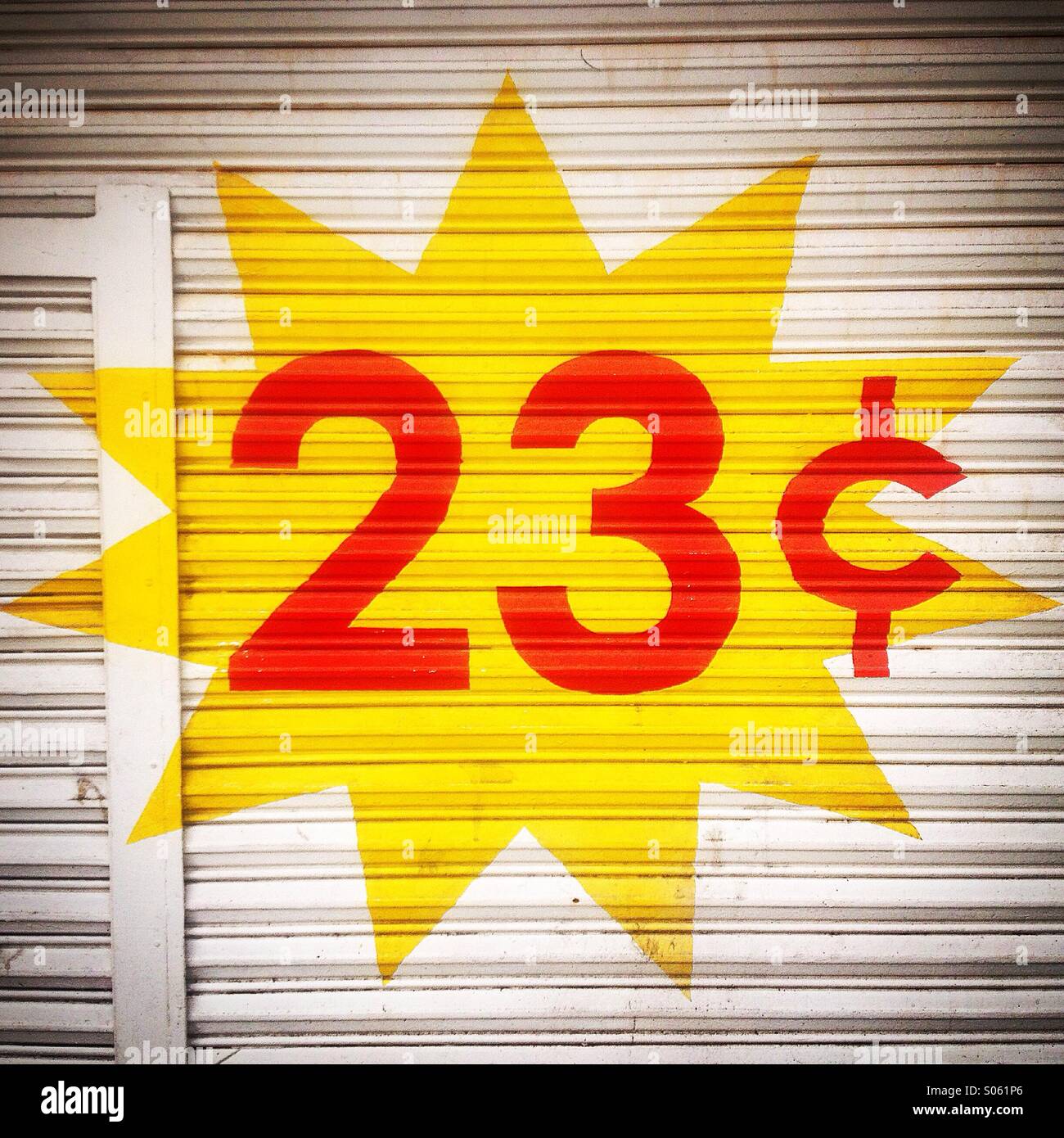 A price sign reading 23 cents decorates a door in a shop in Colonia ...