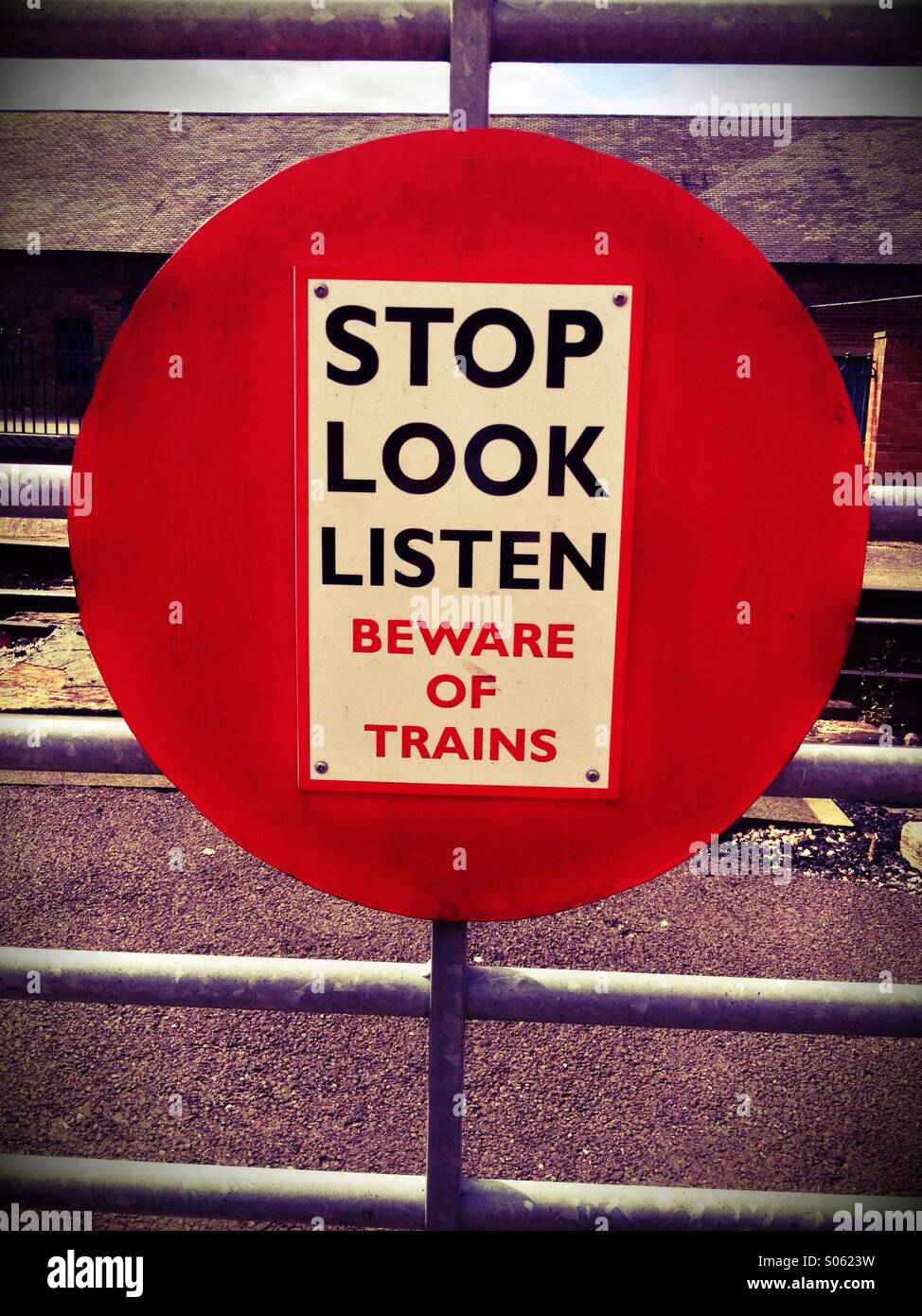 Beware of trains sign Stock Photo - Alamy