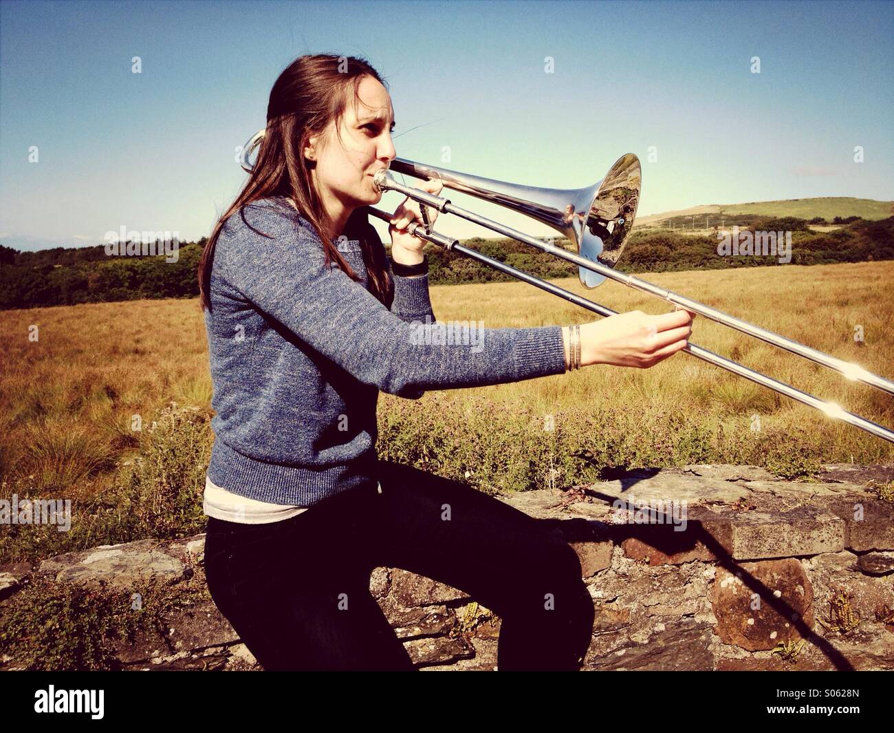 Playing trombone hi-res stock photography and images - Alamy