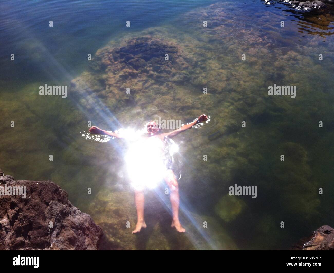 Man floating in light Stock Photo - Alamy