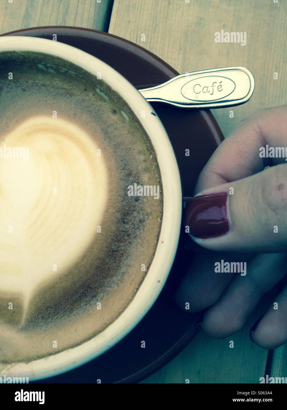 Coffee and hand Stock Photo - Alamy