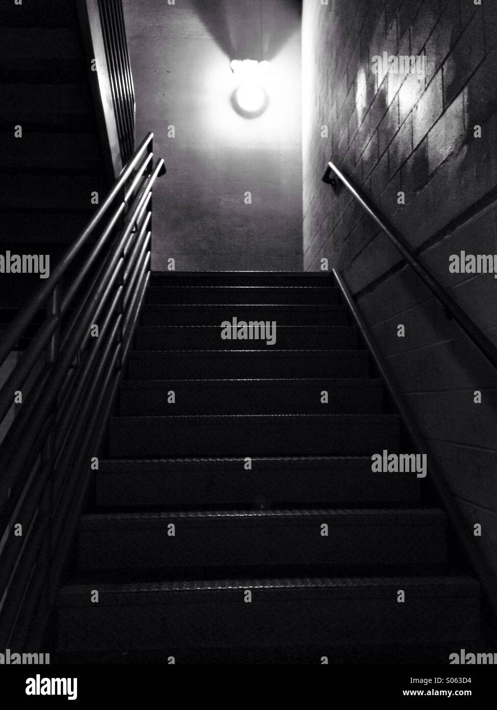 Dimly lighted stairway Stock Photo - Alamy