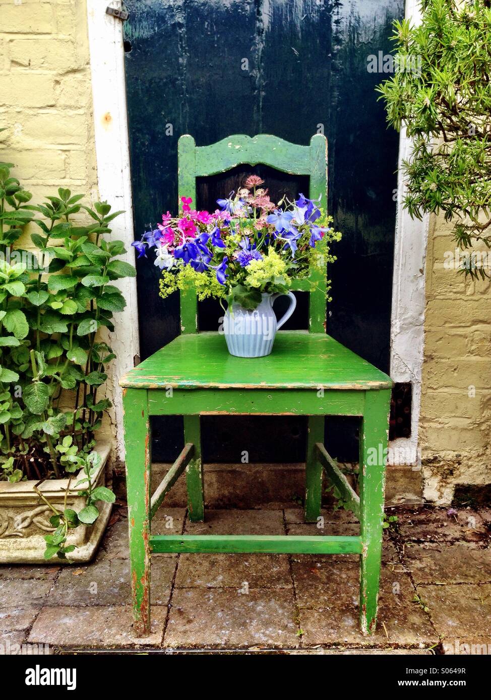 Rustic garden chair hi-res stock photography and images - Alamy