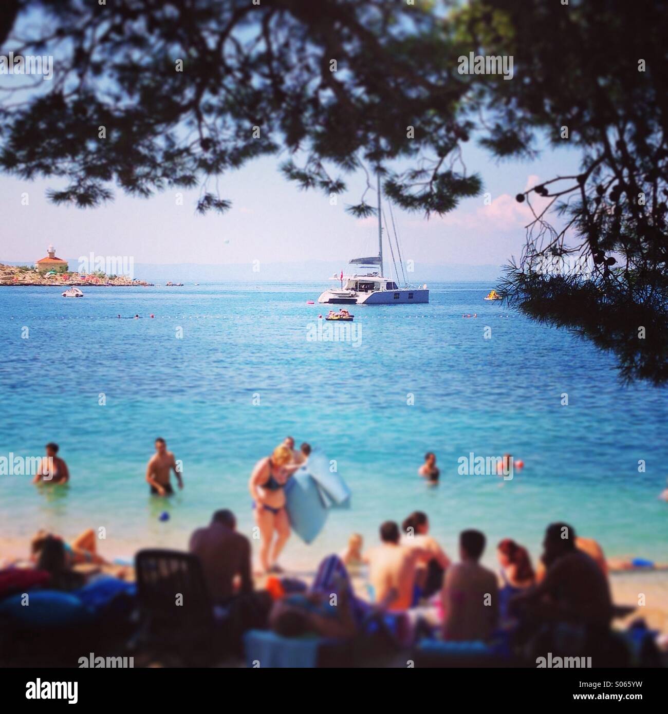 Summer at beach with yacht on blue sea Stock Photo - Alamy