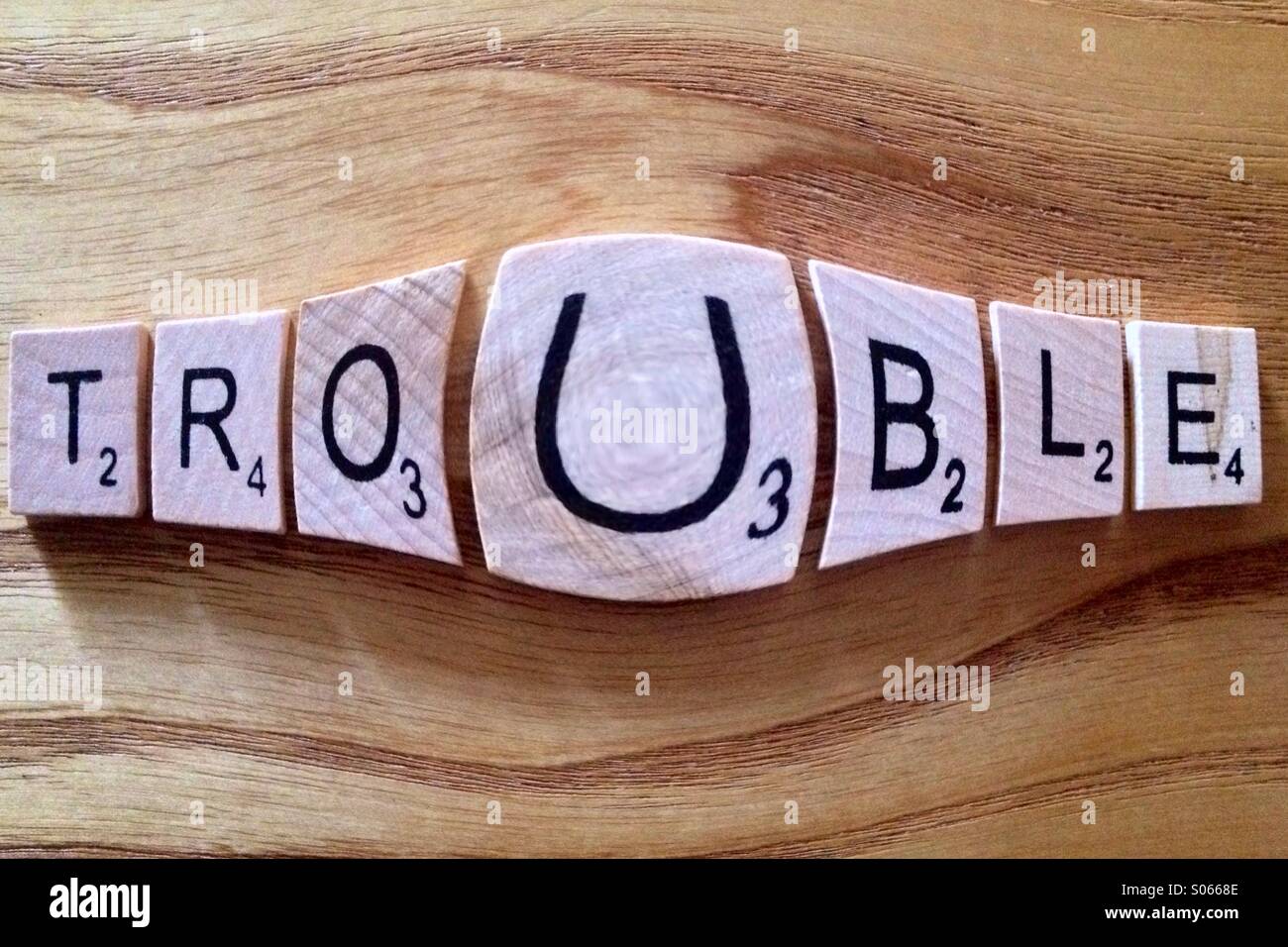 Letters spelling the word trouble Stock Photo - Alamy