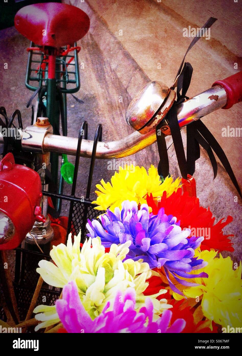 Vintage bike with colorful flowers Stock Photo - Alamy