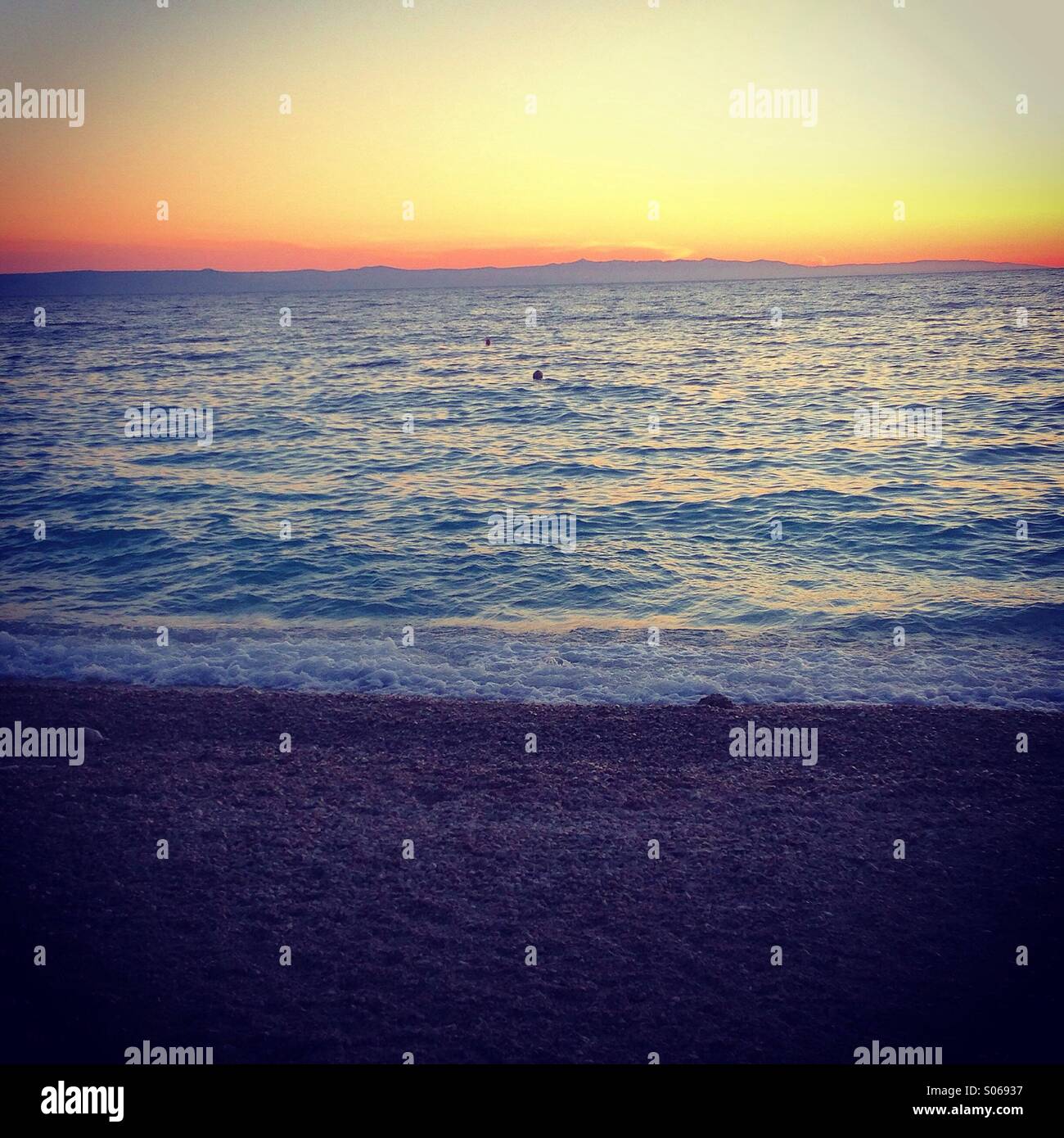 Colorful sunset at beach Stock Photo - Alamy