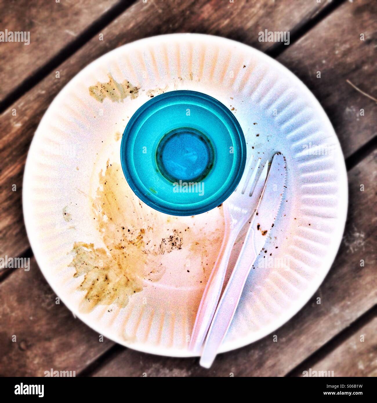 Empty paper plate and plastic cup after camping breakfast Stock Photo ...