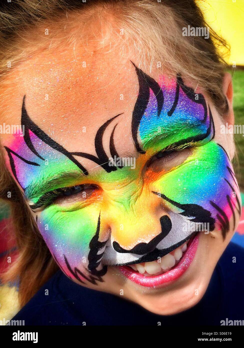 A young girl with facepaint at the fair Stock Photo - Alamy