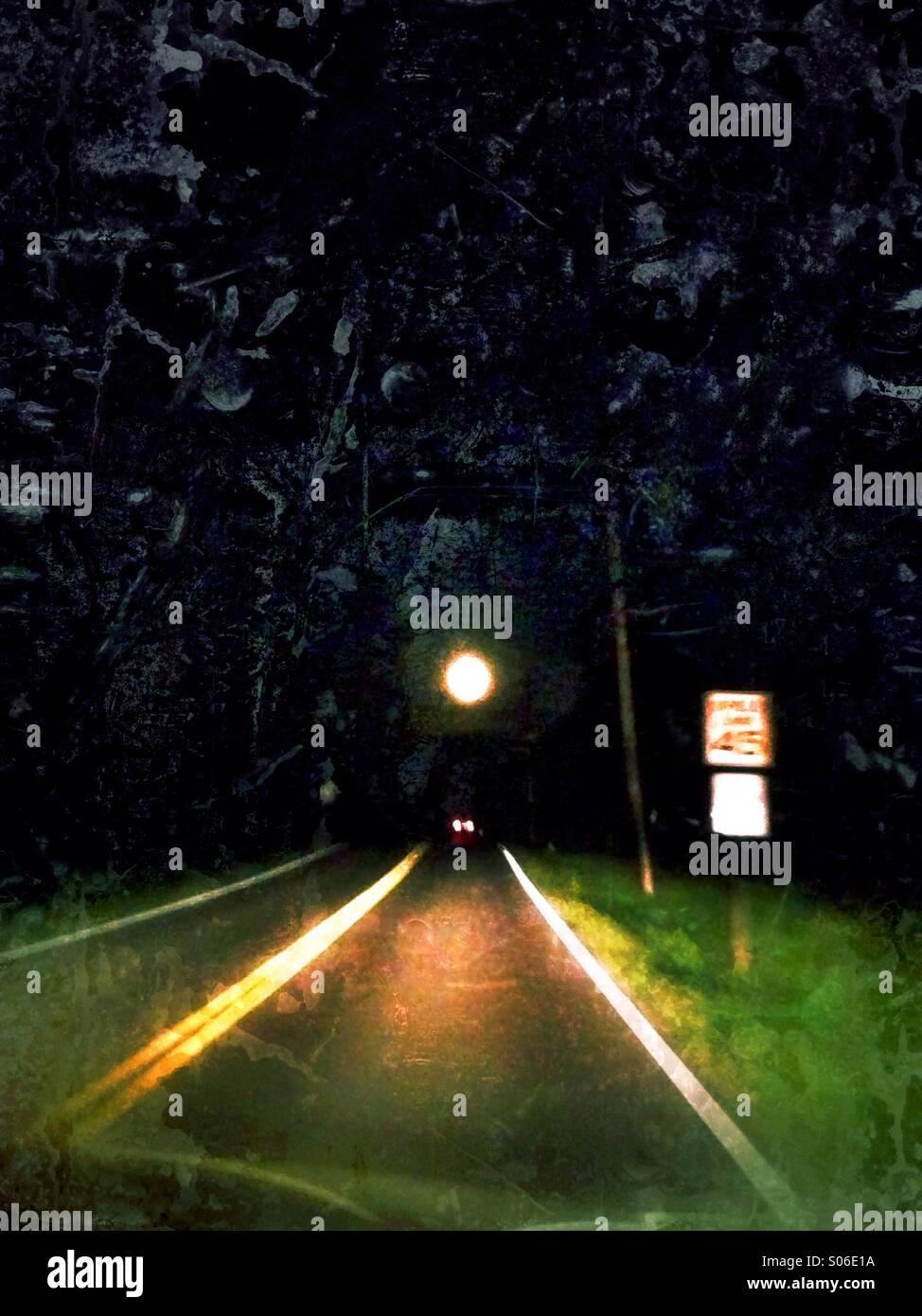 Moon over dark road Stock Photo - Alamy