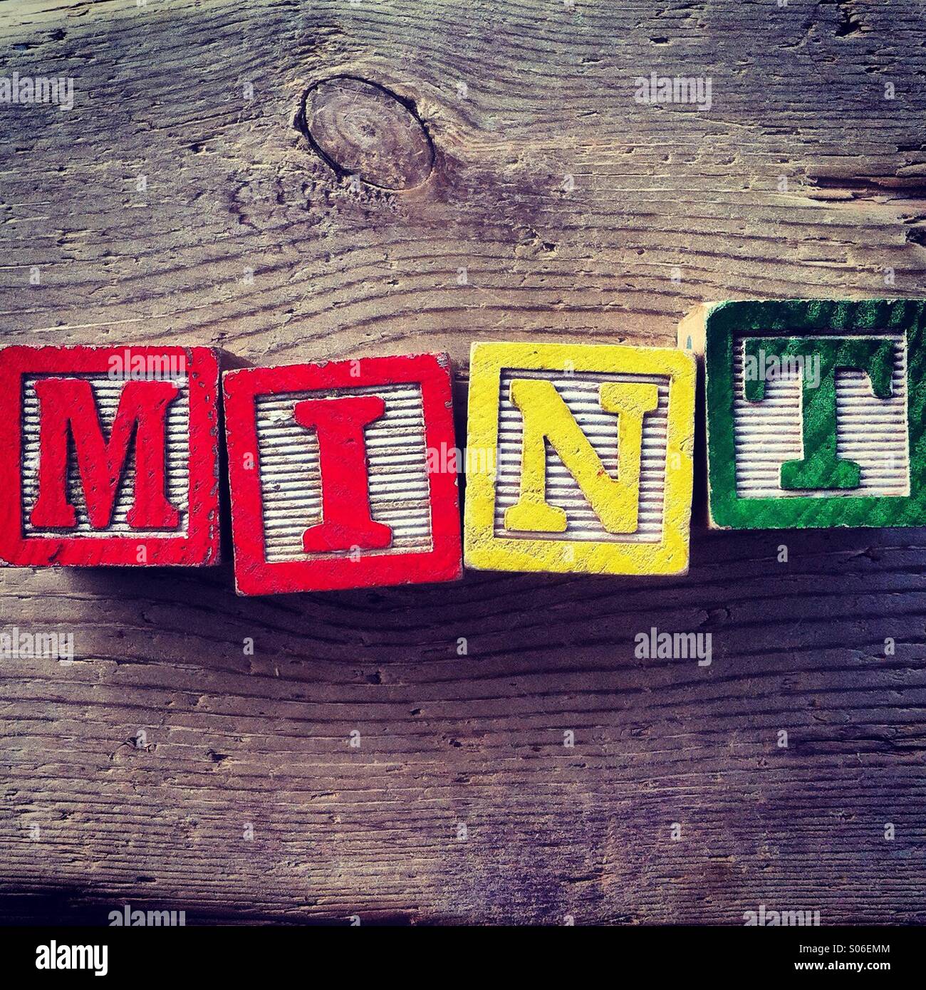 It's a photo of toy woodblocks with alphabet letters on them that are ...