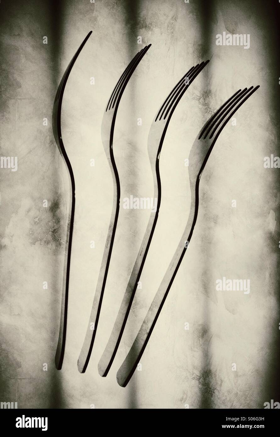 Forks making pattern Stock Photo - Alamy