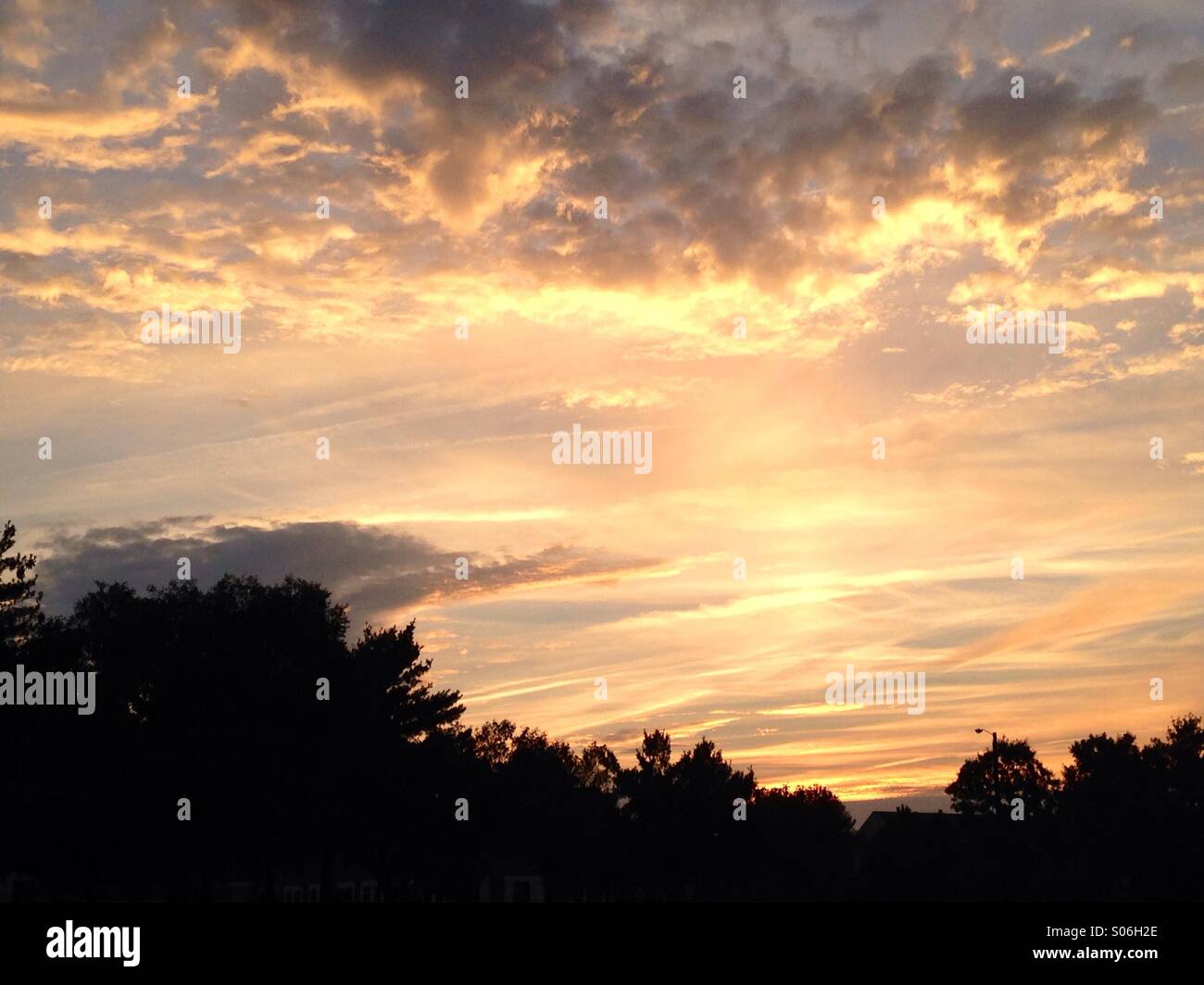 The perfect sunset with the most beautiful colored clouds Stock Photo ...
