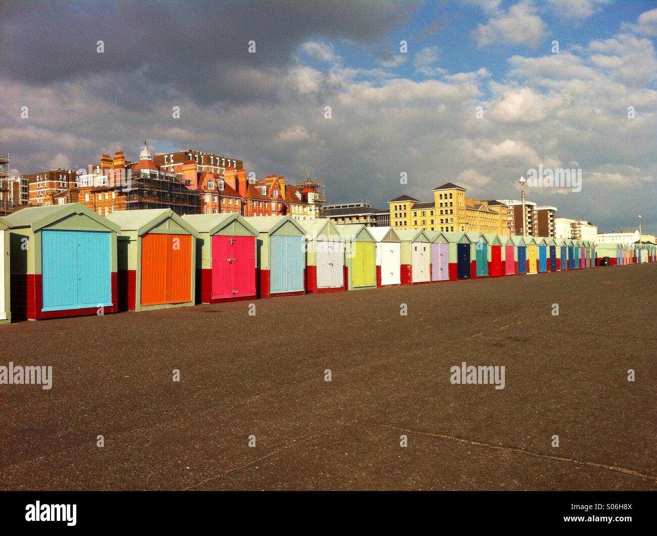 Long line of colourful beach huts Stock Photo - Alamy