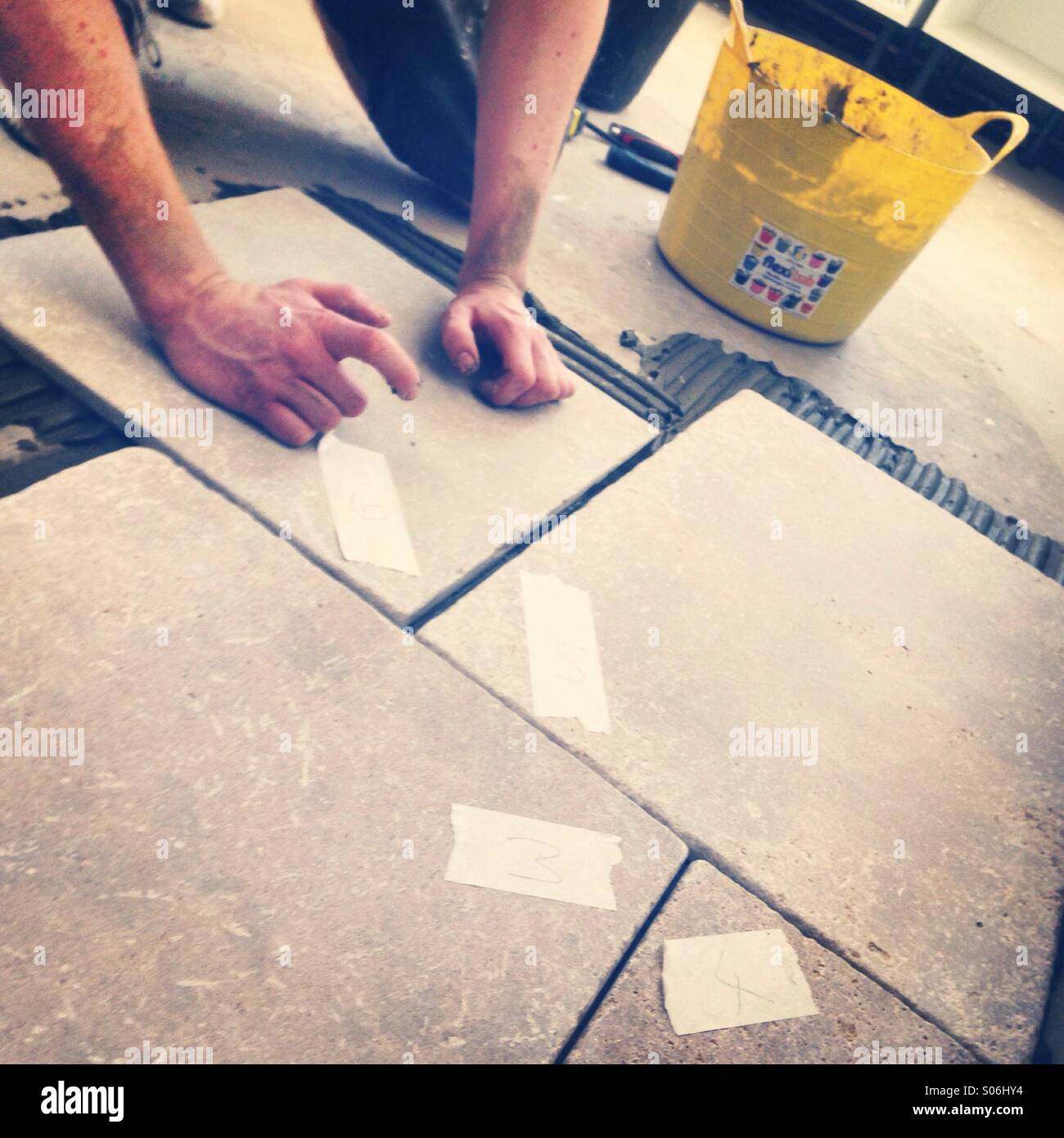 Laying tiles tiles hi-res stock photography and images - Alamy