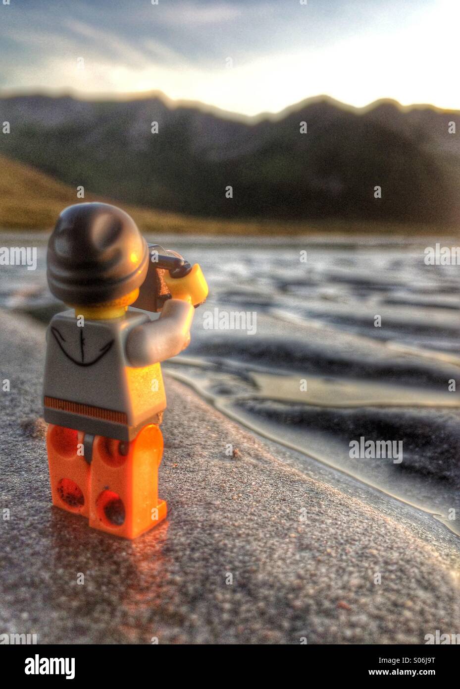 LEGO minifigure photographing midnight sun reaching it's lowest point ...