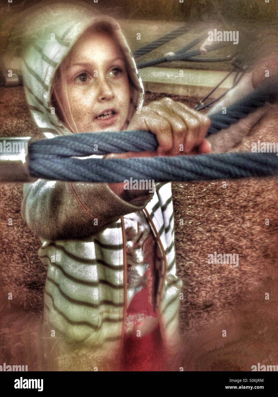 A child rope climbing on the playground Stock Photo - Alamy