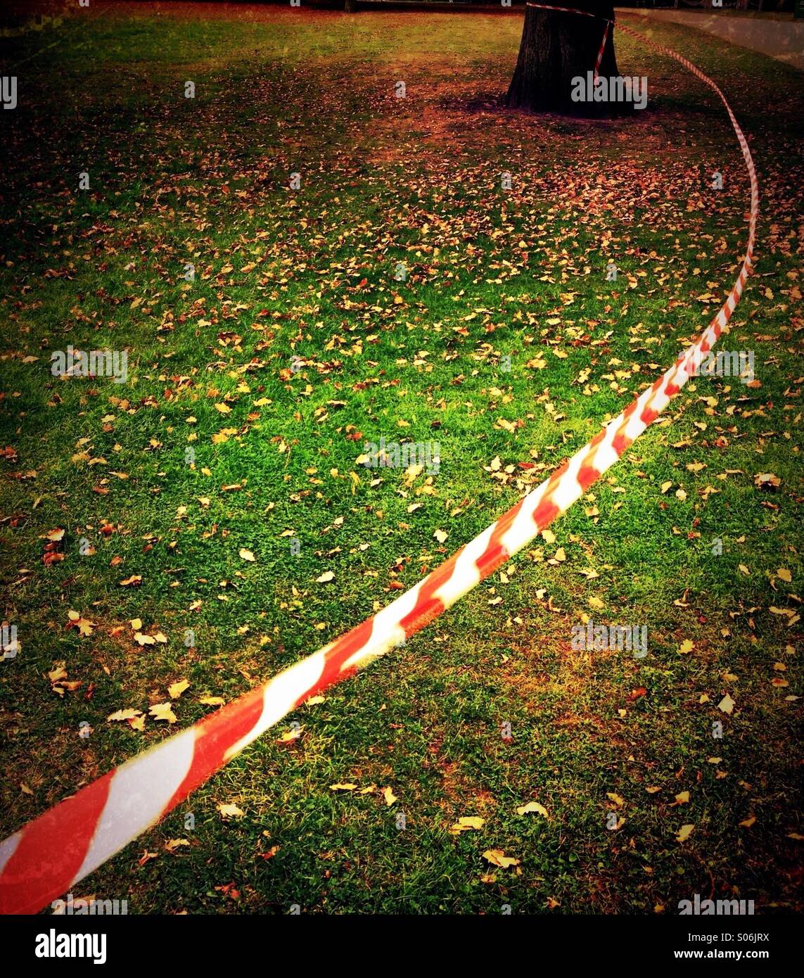 Red and white market tape blowing in wind Stock Photo - Alamy