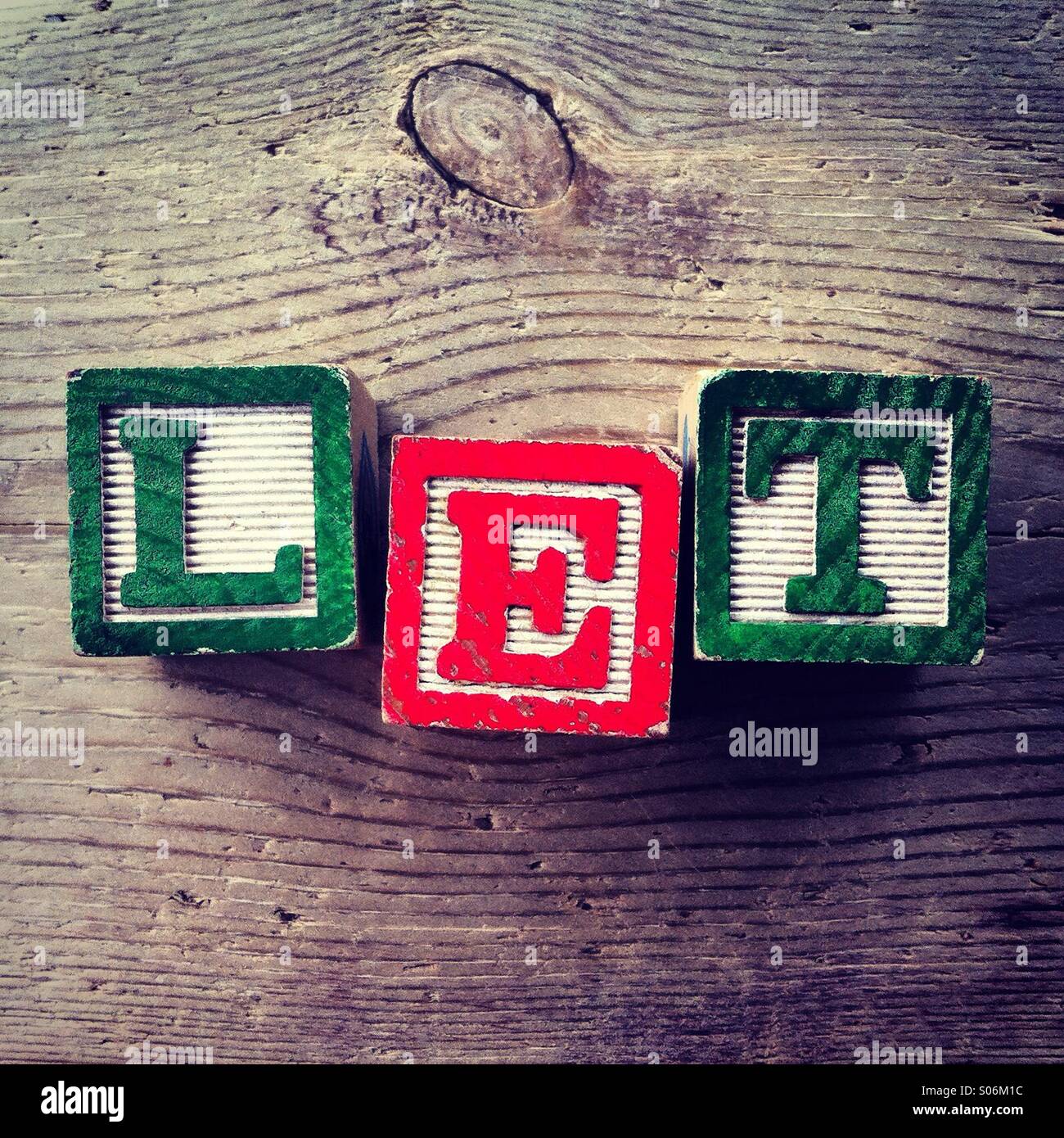 It's a photo of woodblocks toys will alphabet letter on them which are ...