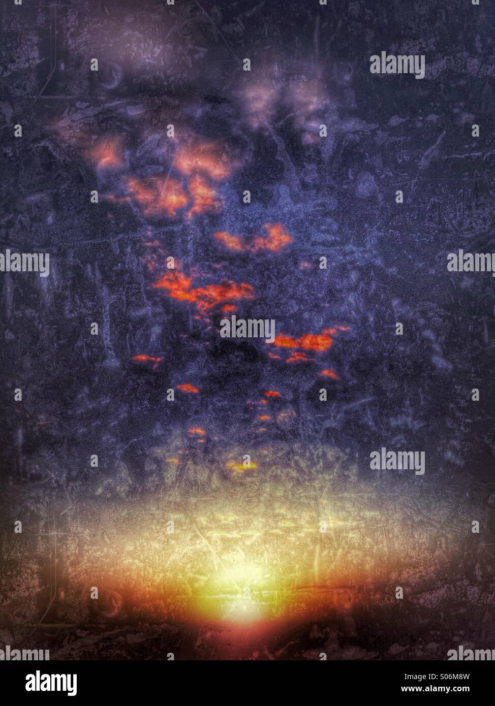 Sun fading in a purple and red sky Stock Photo - Alamy