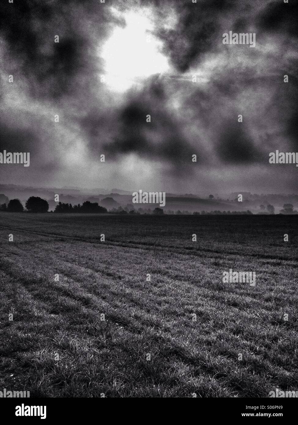 Overcast countryside with mist in valley Stock Photo - Alamy