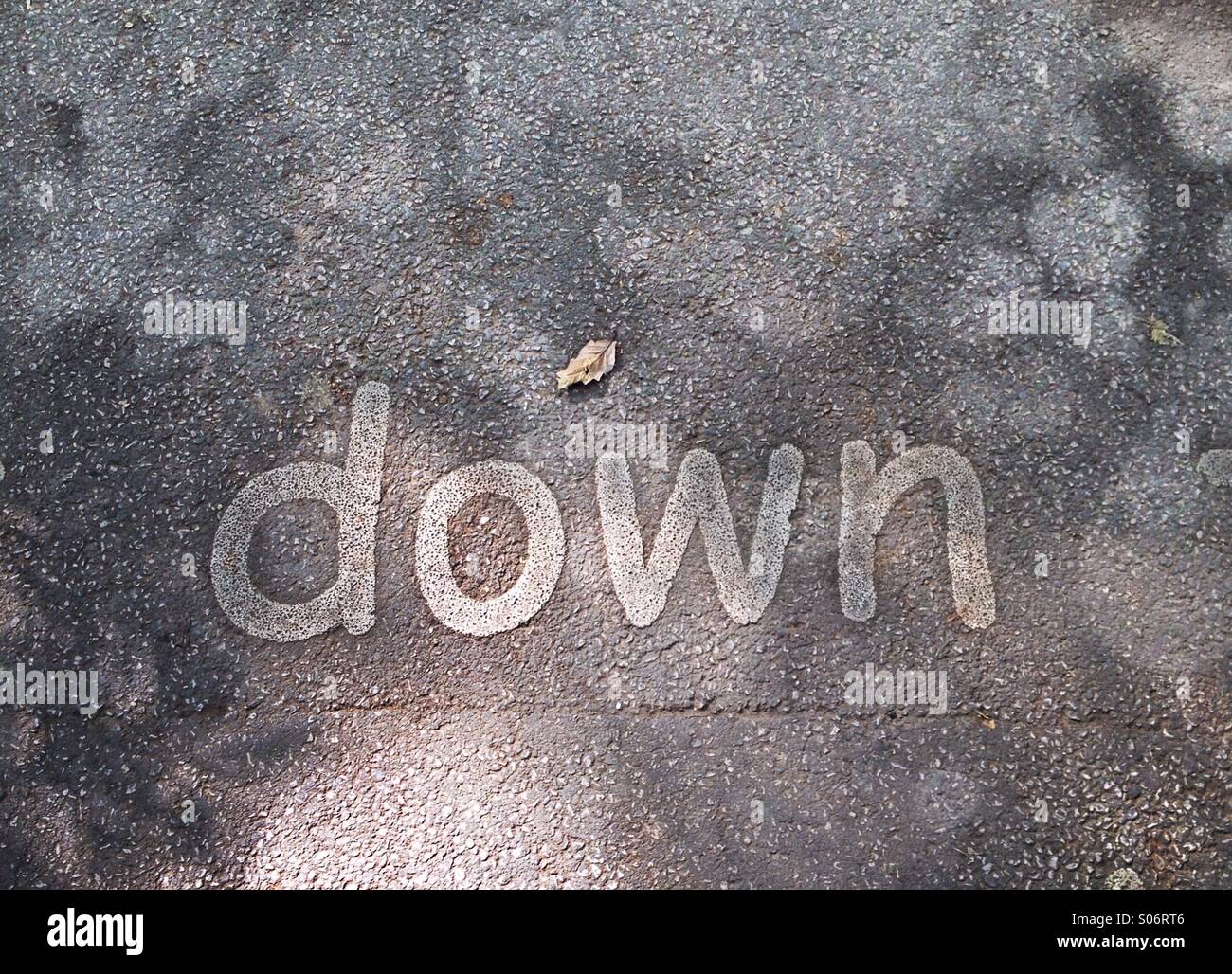 The word down wrote on path Stock Photo - Alamy