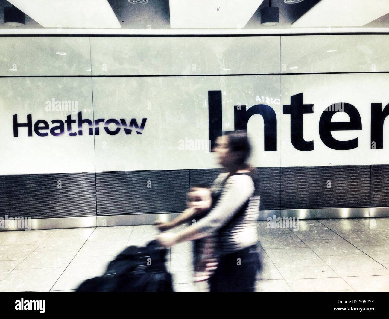 Mother and child, Heathrow airport,London,UK Stock Photo - Alamy