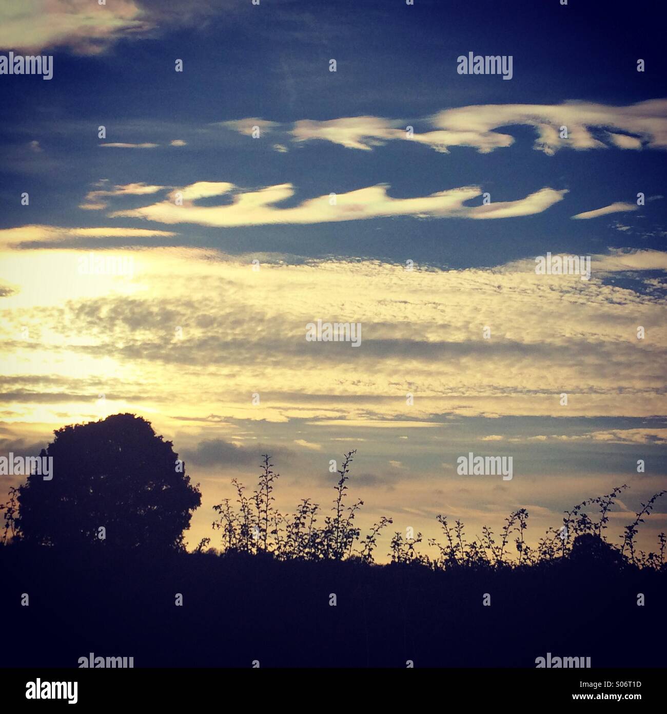 Wave pattern in clouds at dusk Stock Photo - Alamy