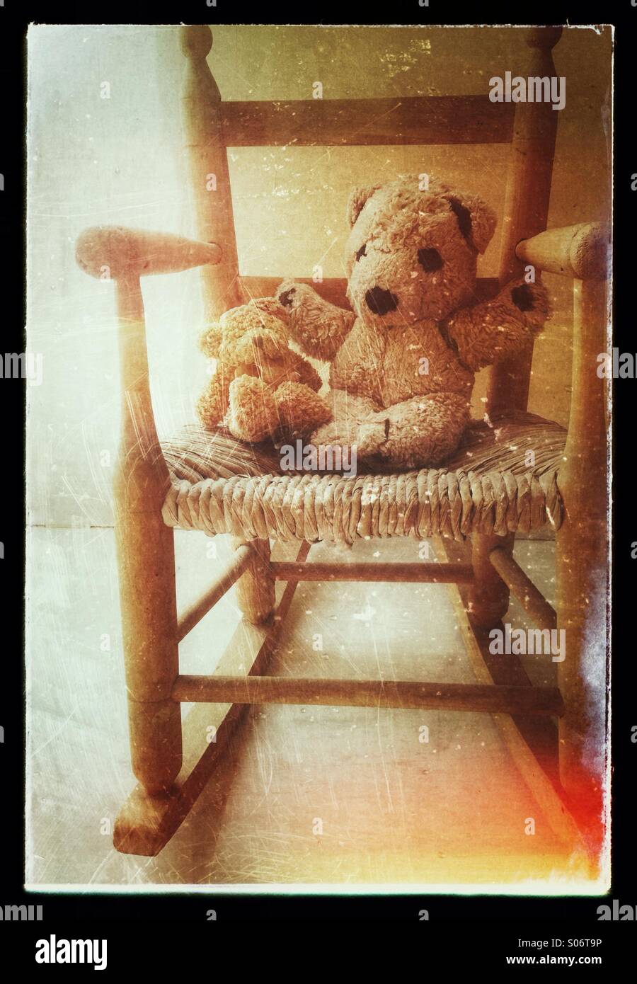 Two teddy bears sat on child's rocking chair Stock Photo - Alamy