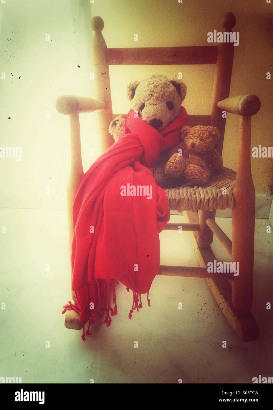 Two teddy bears sitting on child's rocking chair Stock Photo - Alamy