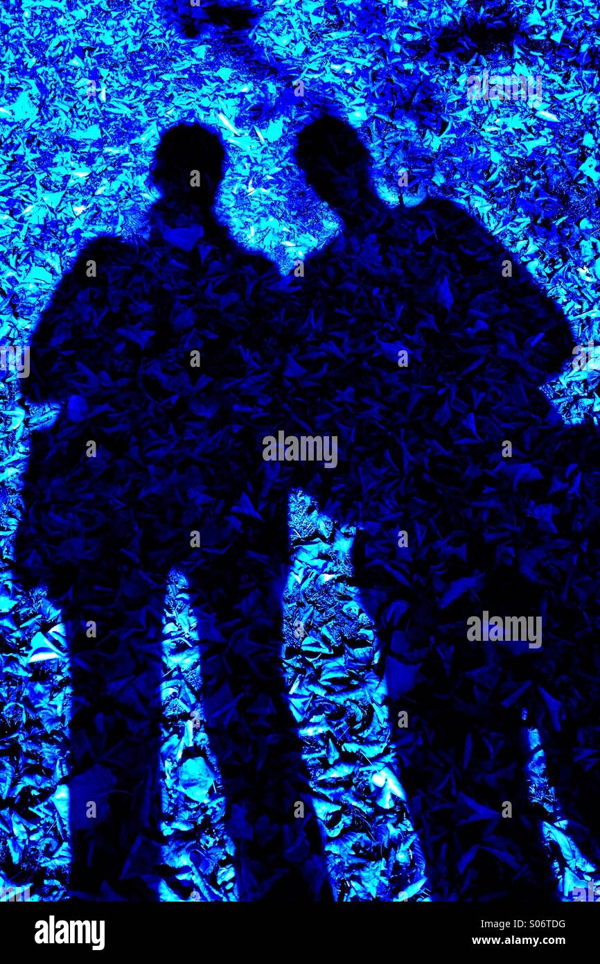 Reflection of two people Stock Photo - Alamy