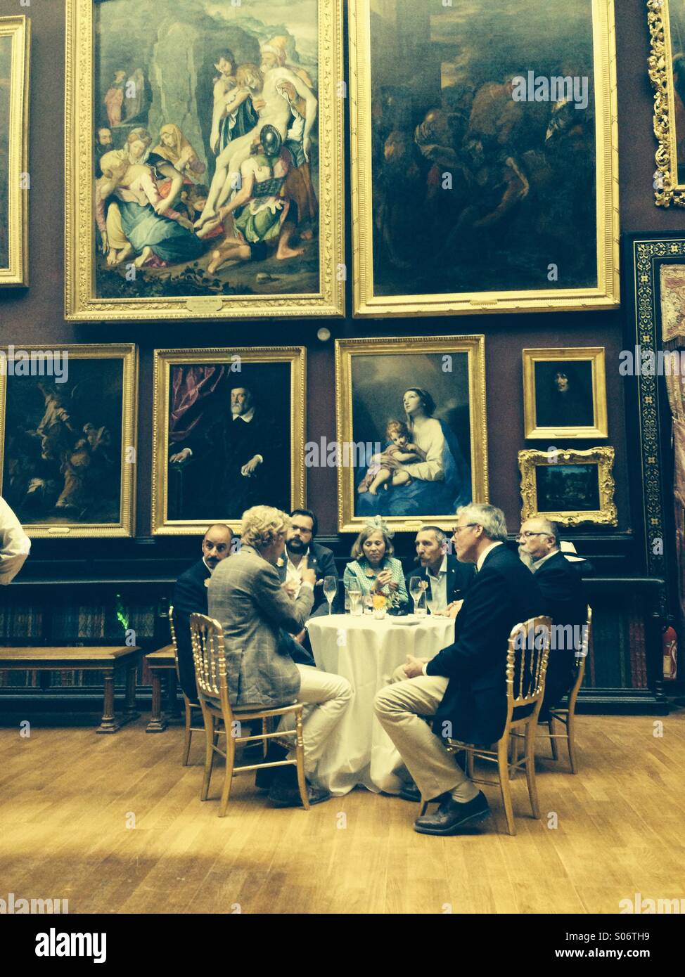 People having dinner in an art gallery Stock Photo - Alamy