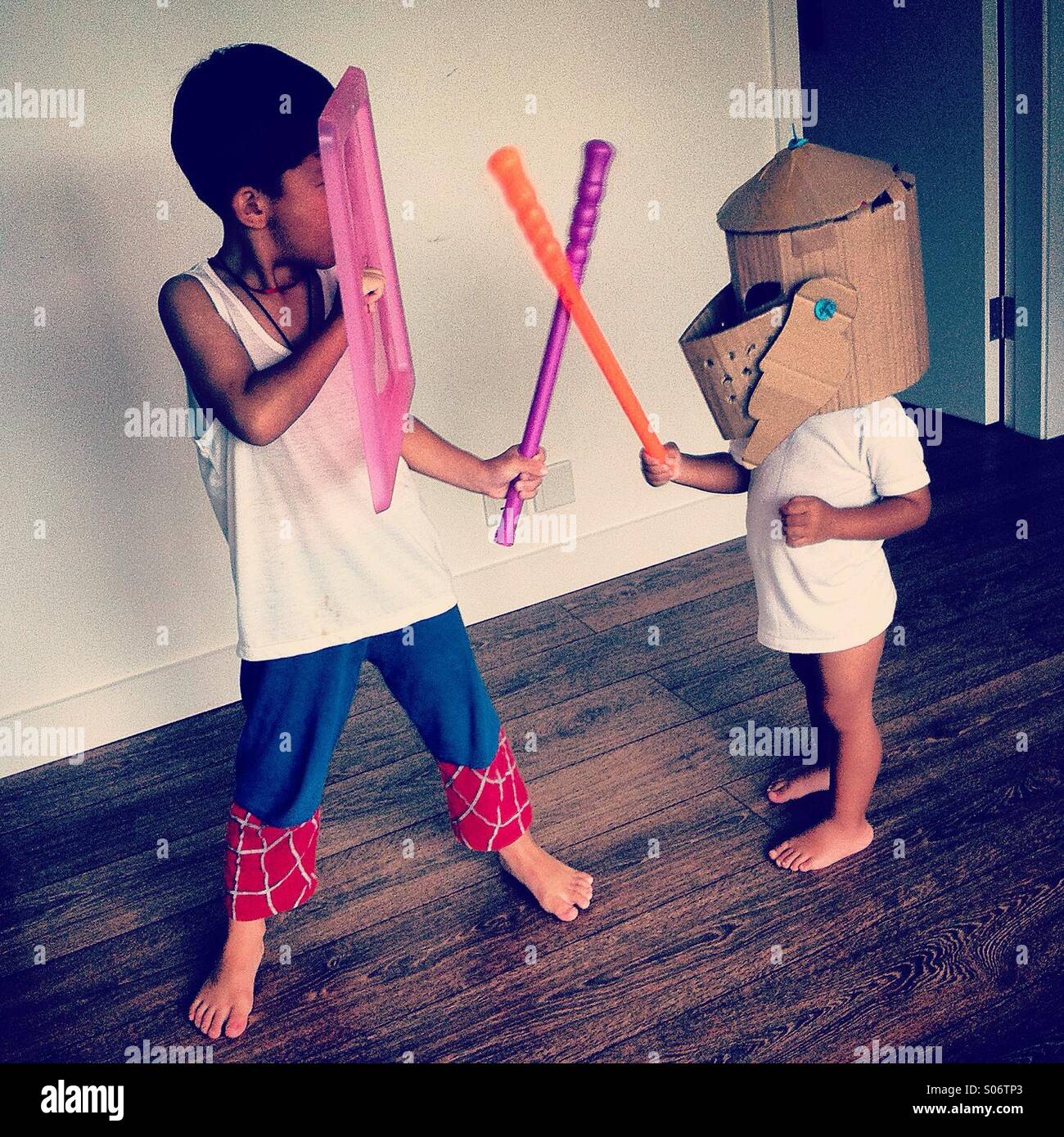 Two brother boys ready to fight like knights with homemade toys Stock ...