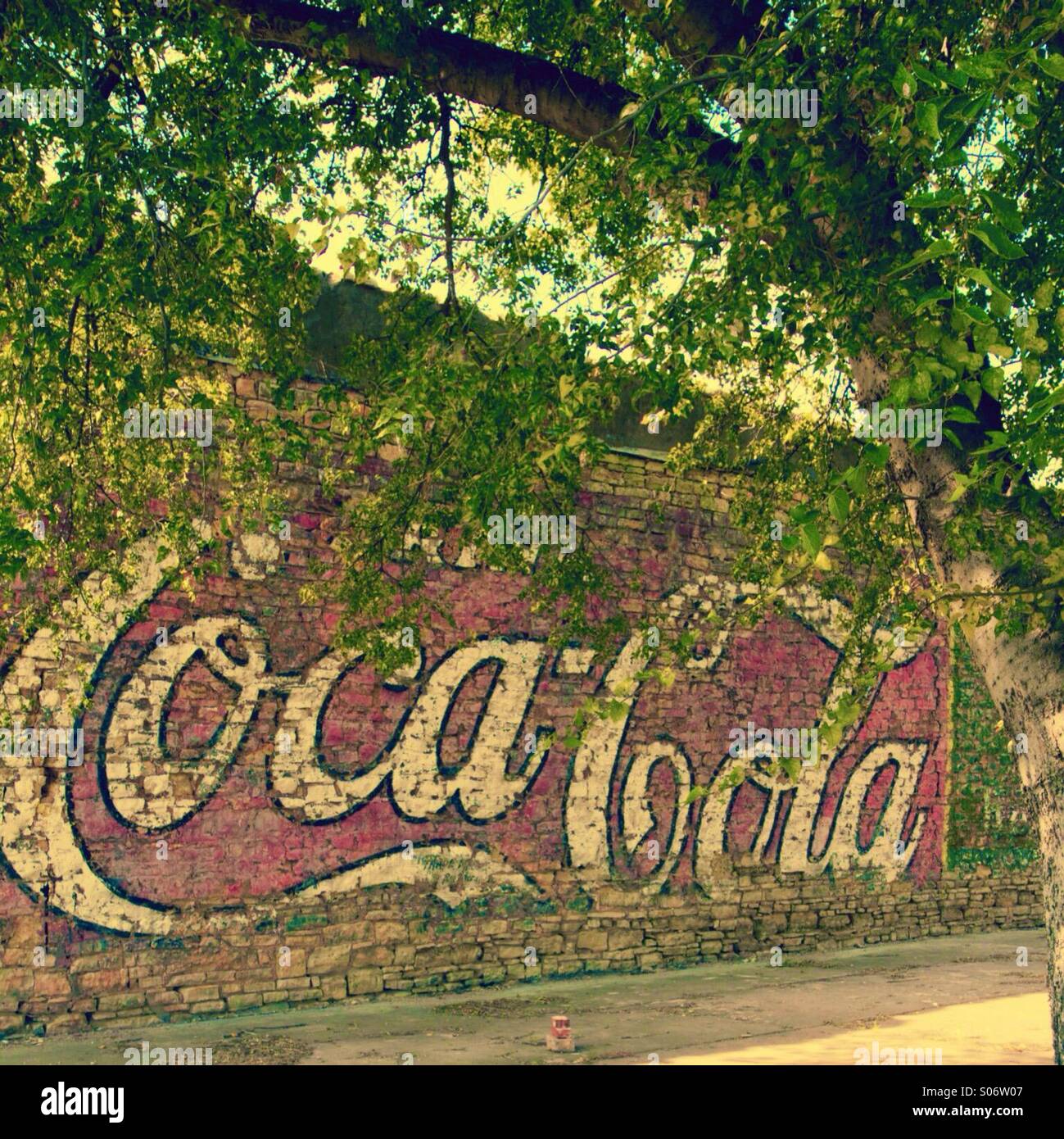Old building with Coca Cola sign Stock Photo - Alamy