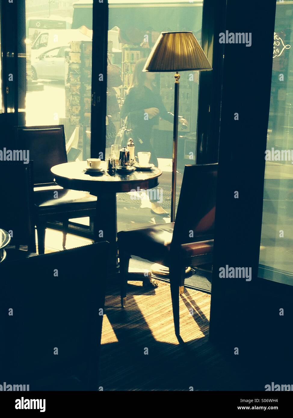 Cafe window onto Paris Street Stock Photo - Alamy