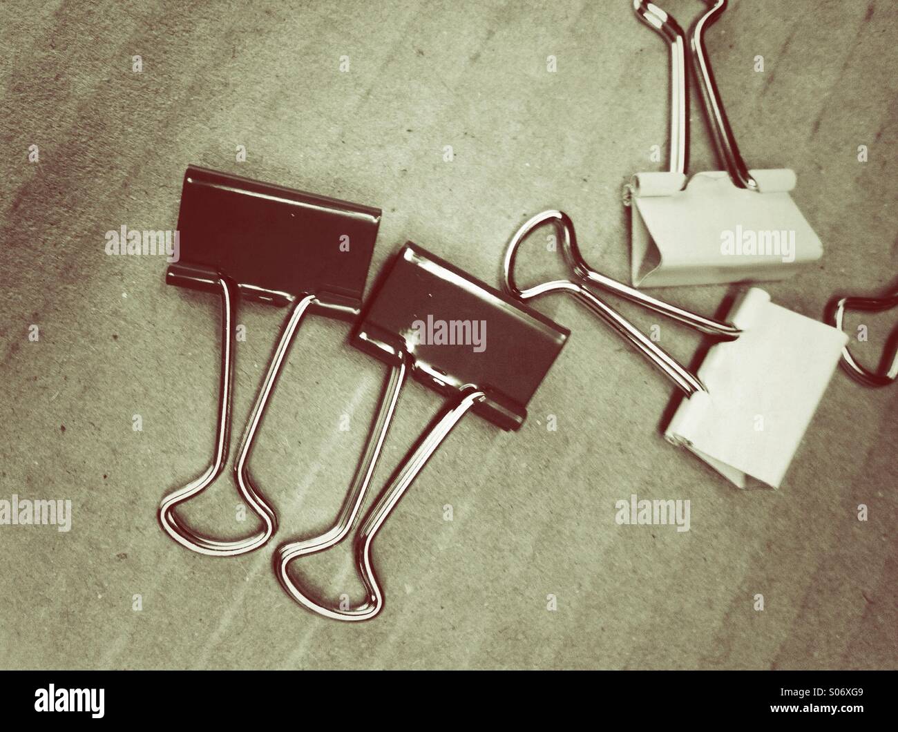 metal paper clips on cardboard Stock Photo - Alamy