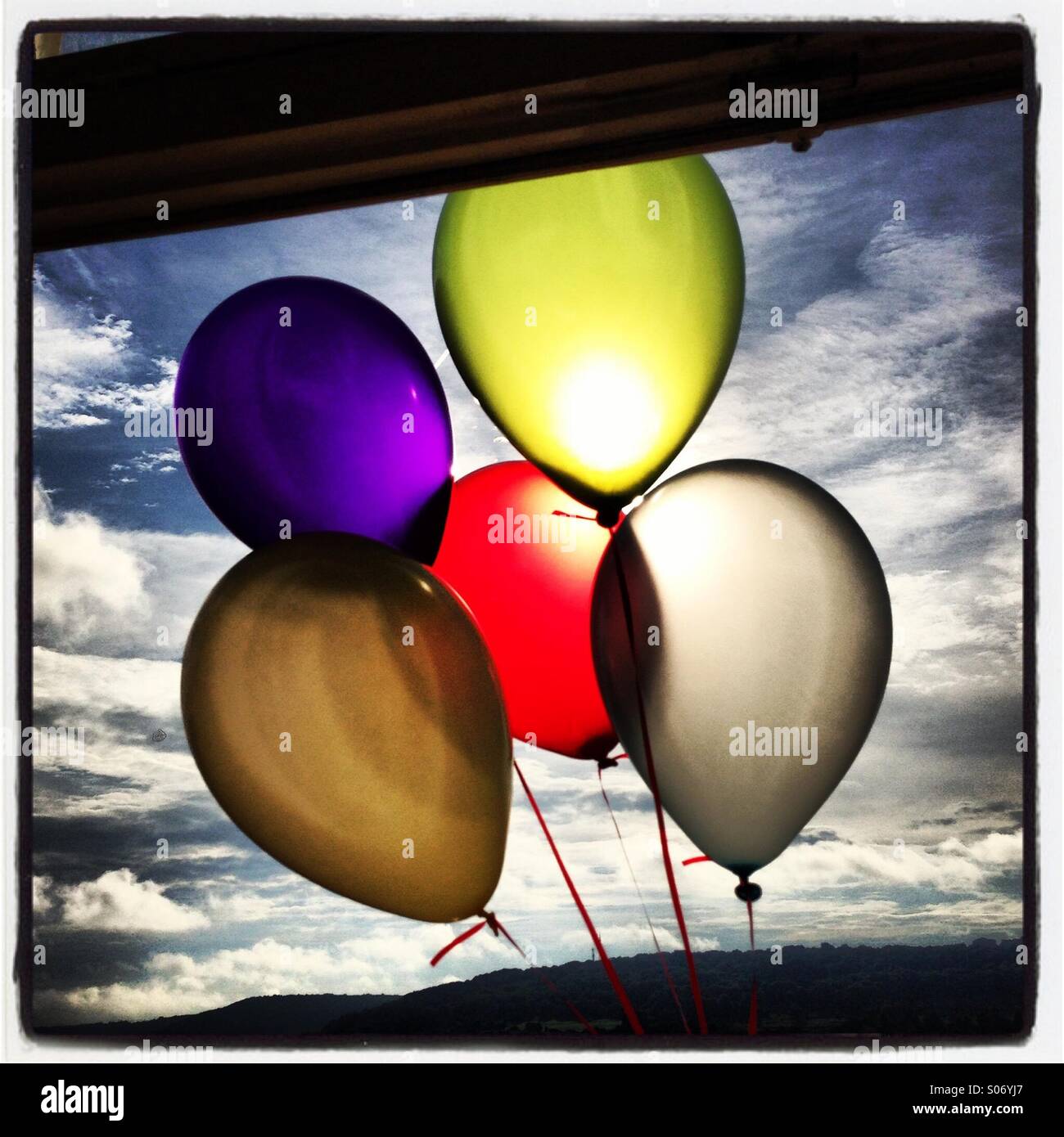 Coloured balloons hi-res stock photography and images - Alamy