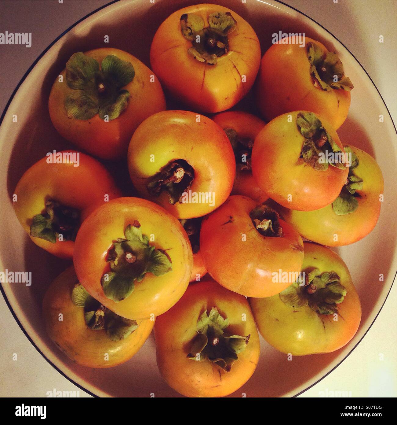 Organic persimmons hi-res stock photography and images - Alamy