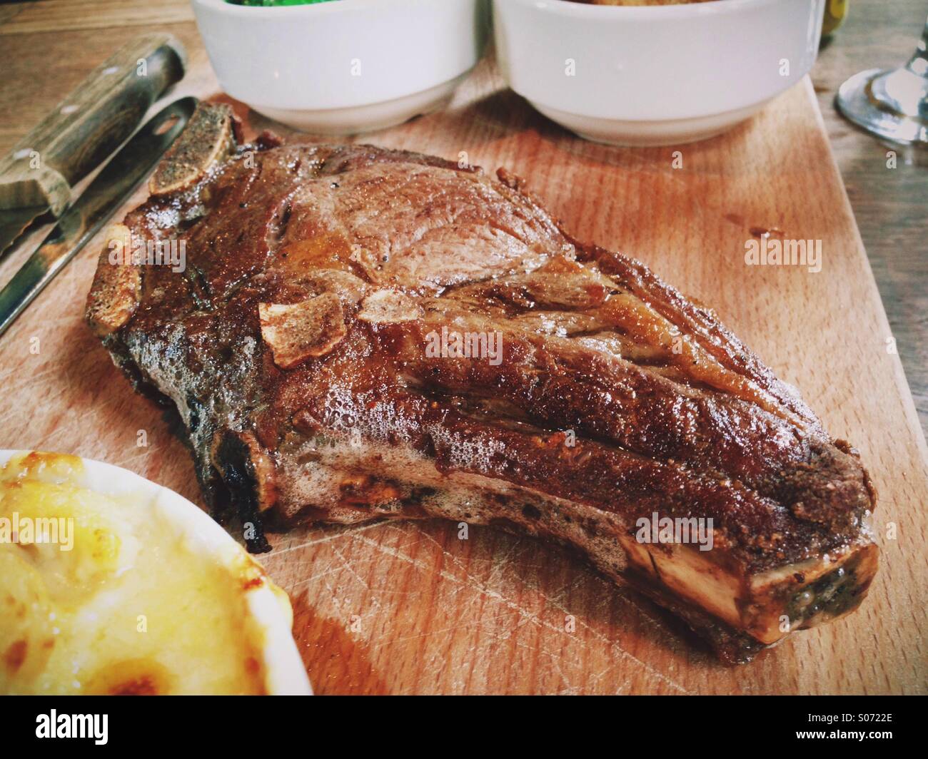 Roast rib of beef at a Sunday lunch Stock Photo - Alamy