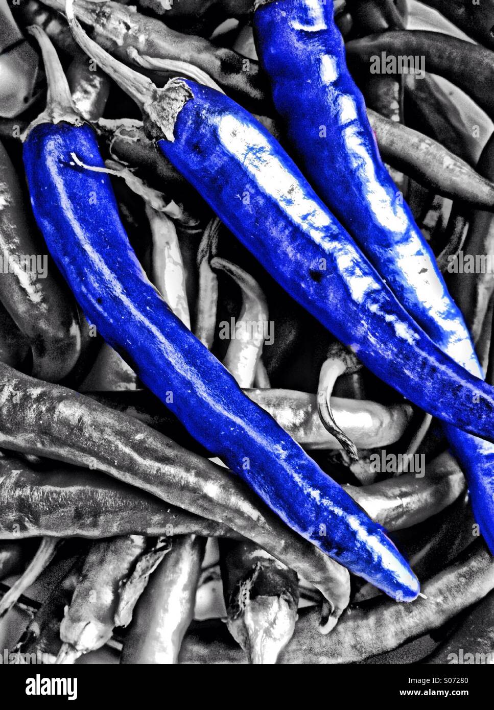 Colour change on hot chilli peppers Stock Photo - Alamy