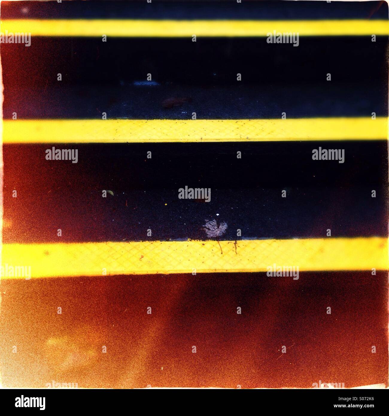 Steps with yellow safety lines Stock Photo - Alamy
