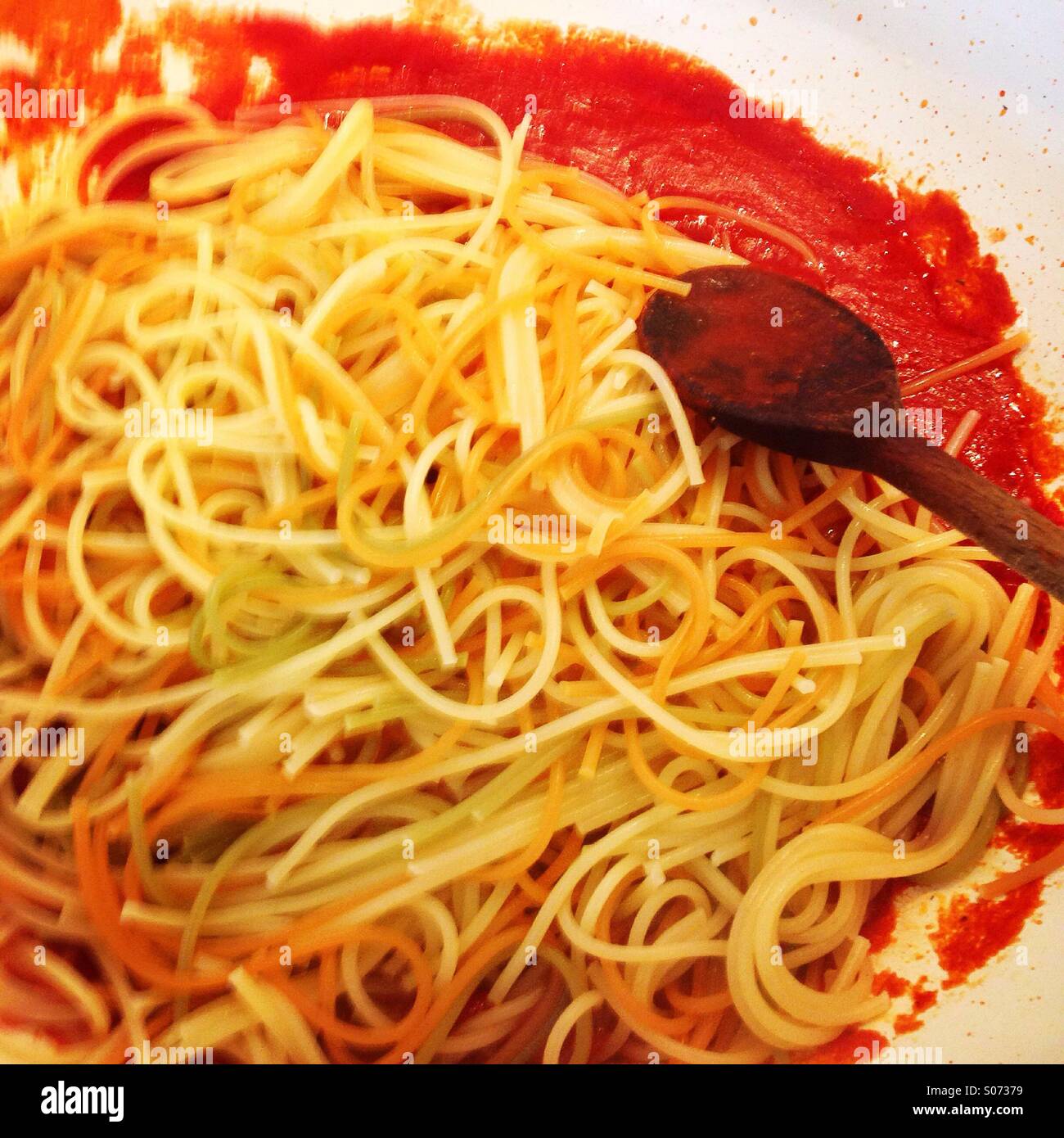 Cooking spaghetti pasta with tomato sauce Stock Photo - Alamy