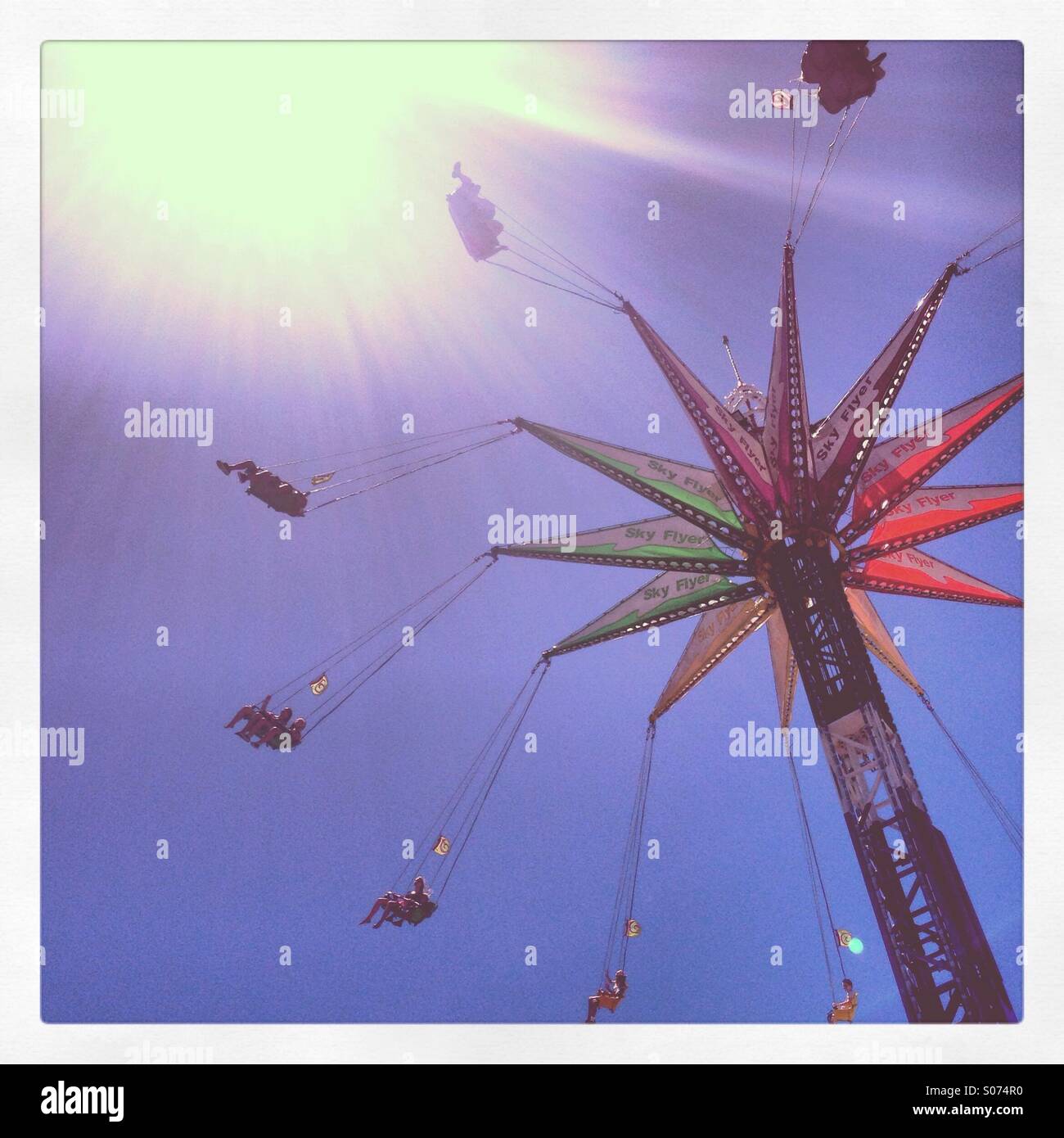 On the swings at the fair Stock Photo - Alamy