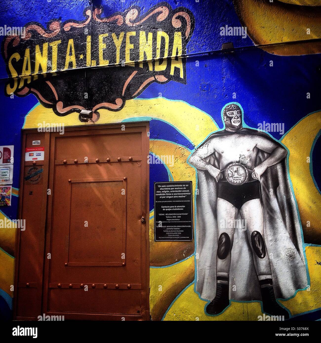 A painting of a Mexican Lucha Libre wrestler decorates the entrance of ...