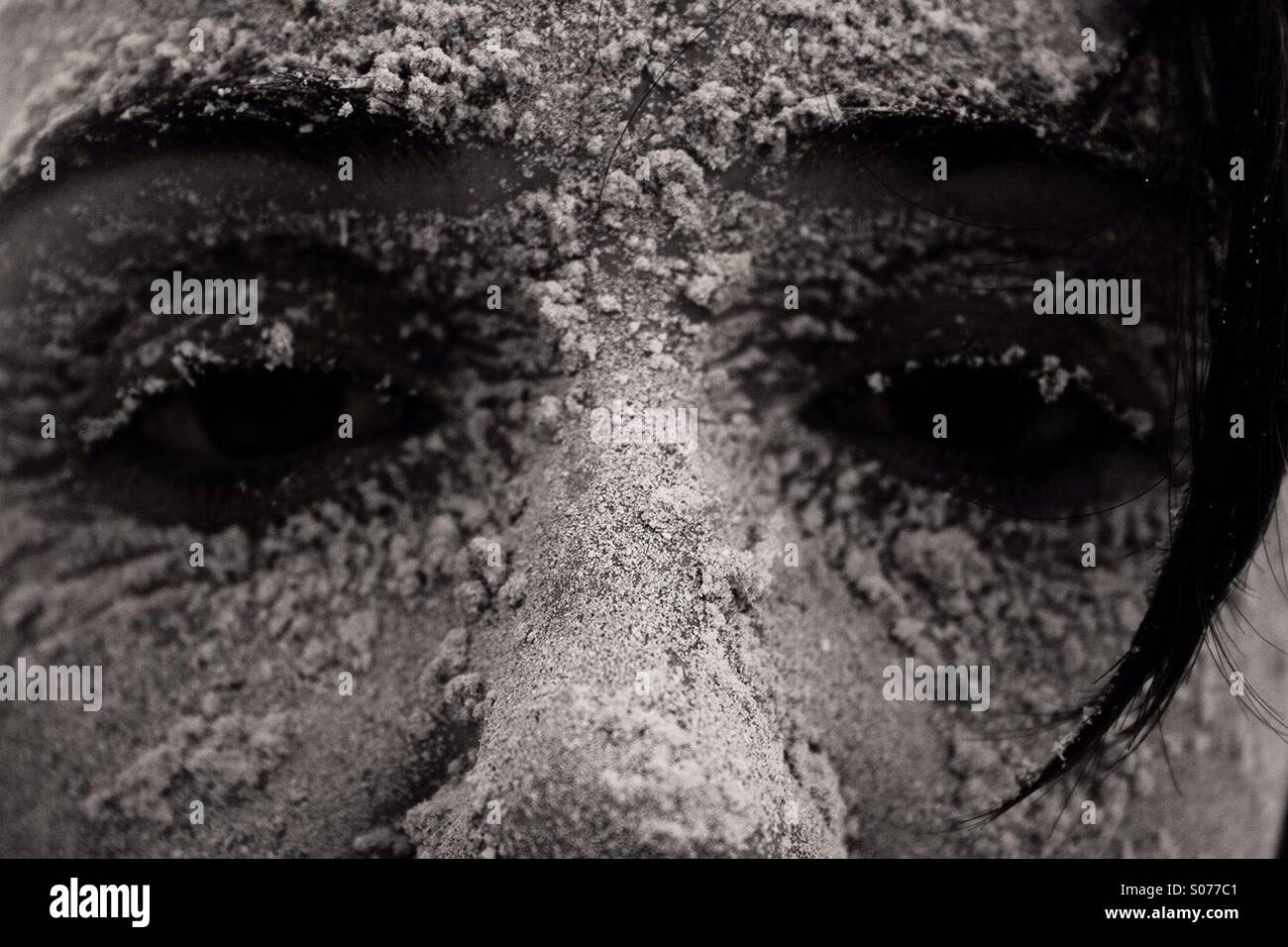 A woman's face covered in sand Stock Photo - Alamy