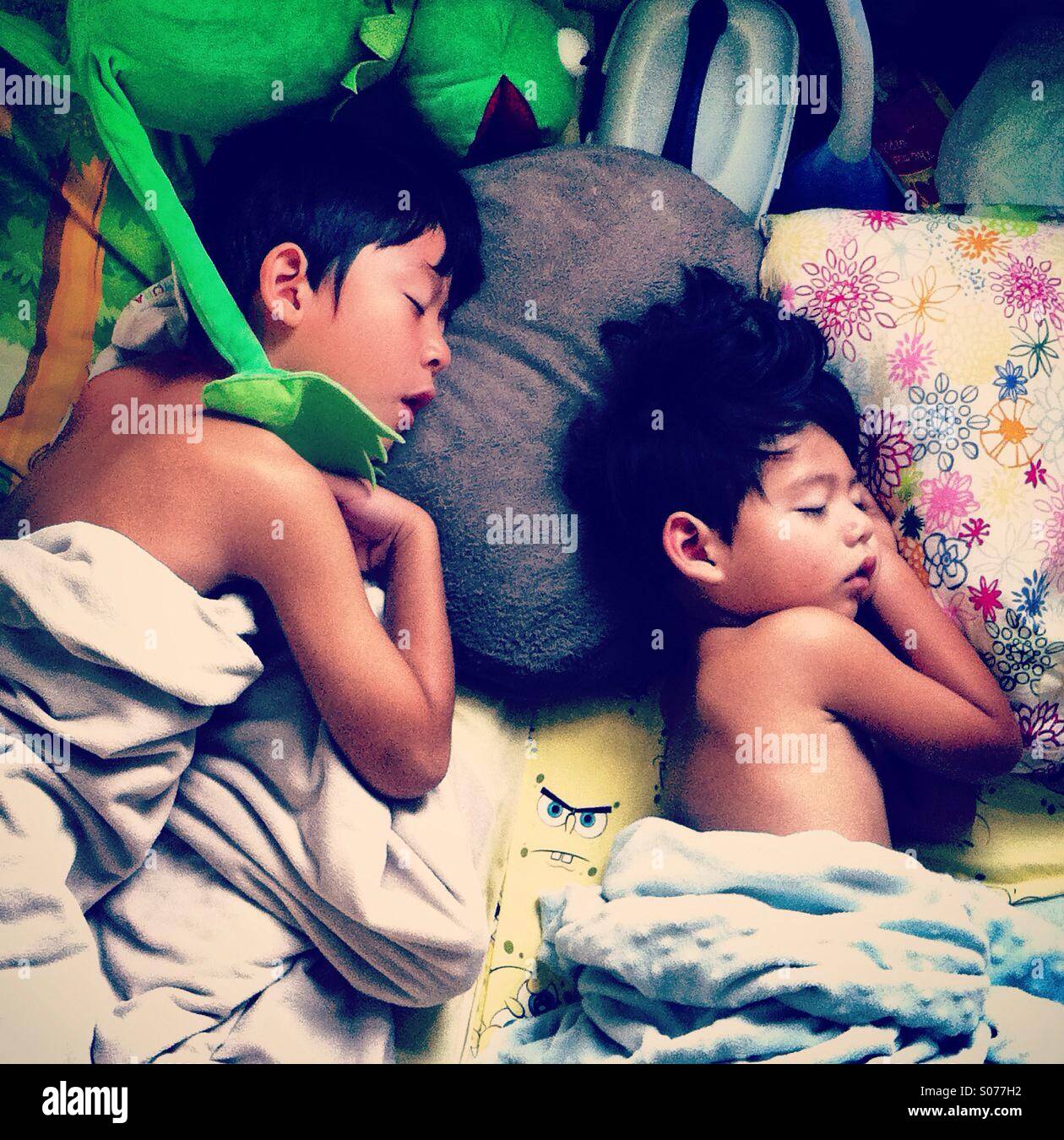 Two sleeping brother boys Stock Photo - Alamy