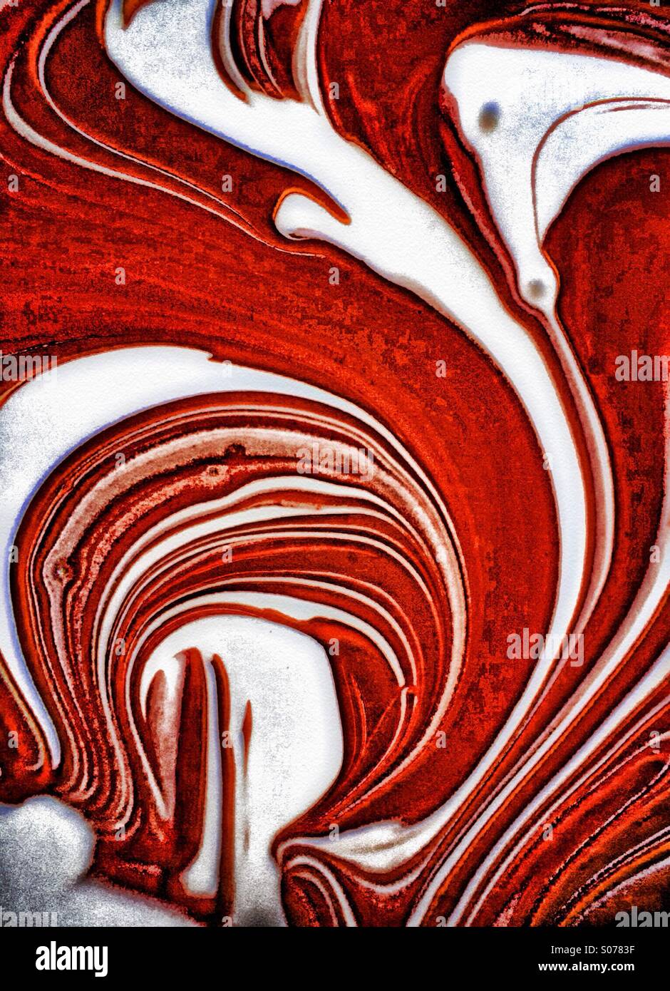 Paint swirling together Stock Photo - Alamy