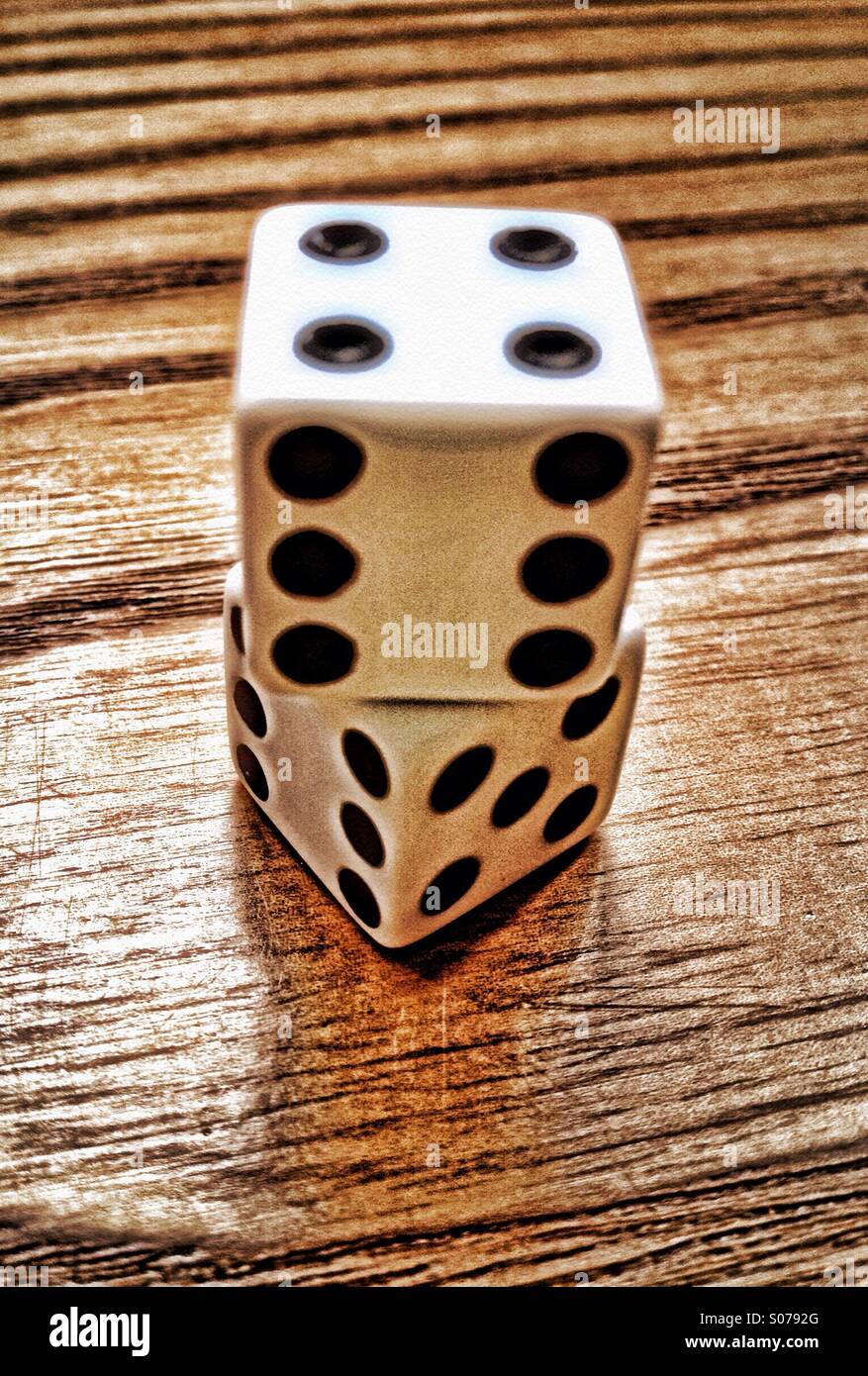 Dice on a table Stock Photo - Alamy